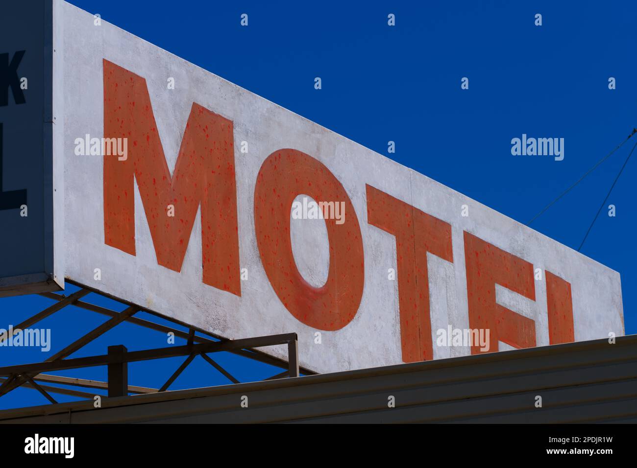 Motel sign background board on a building, with a blue sky background ...