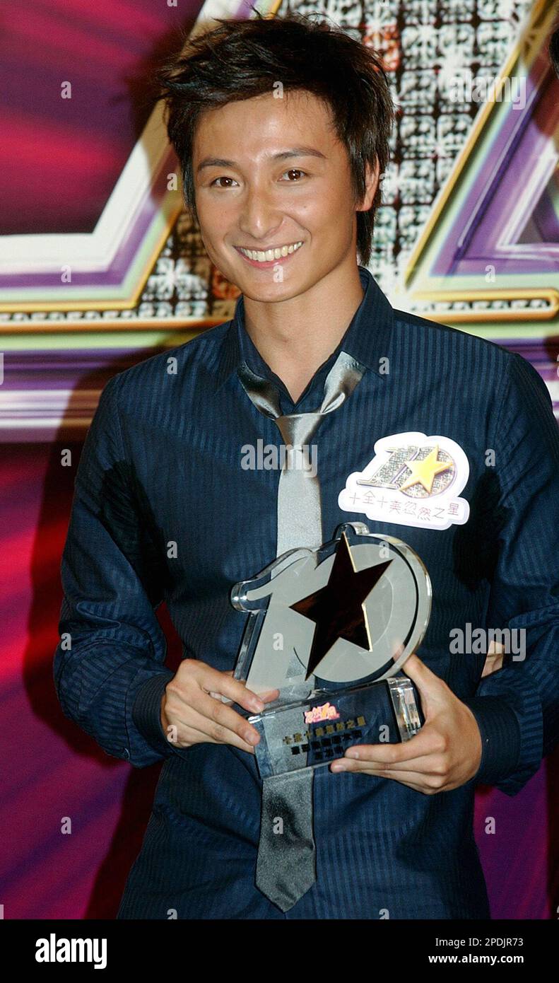 Hong Kong singer and actor Alex Fong receives a prize for his healthy ...