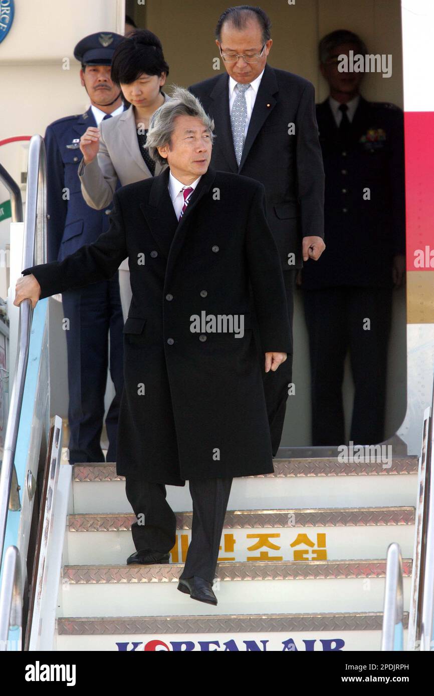 Japanese Prime Minister Junichiro Koizumi steps down a staircase after ...