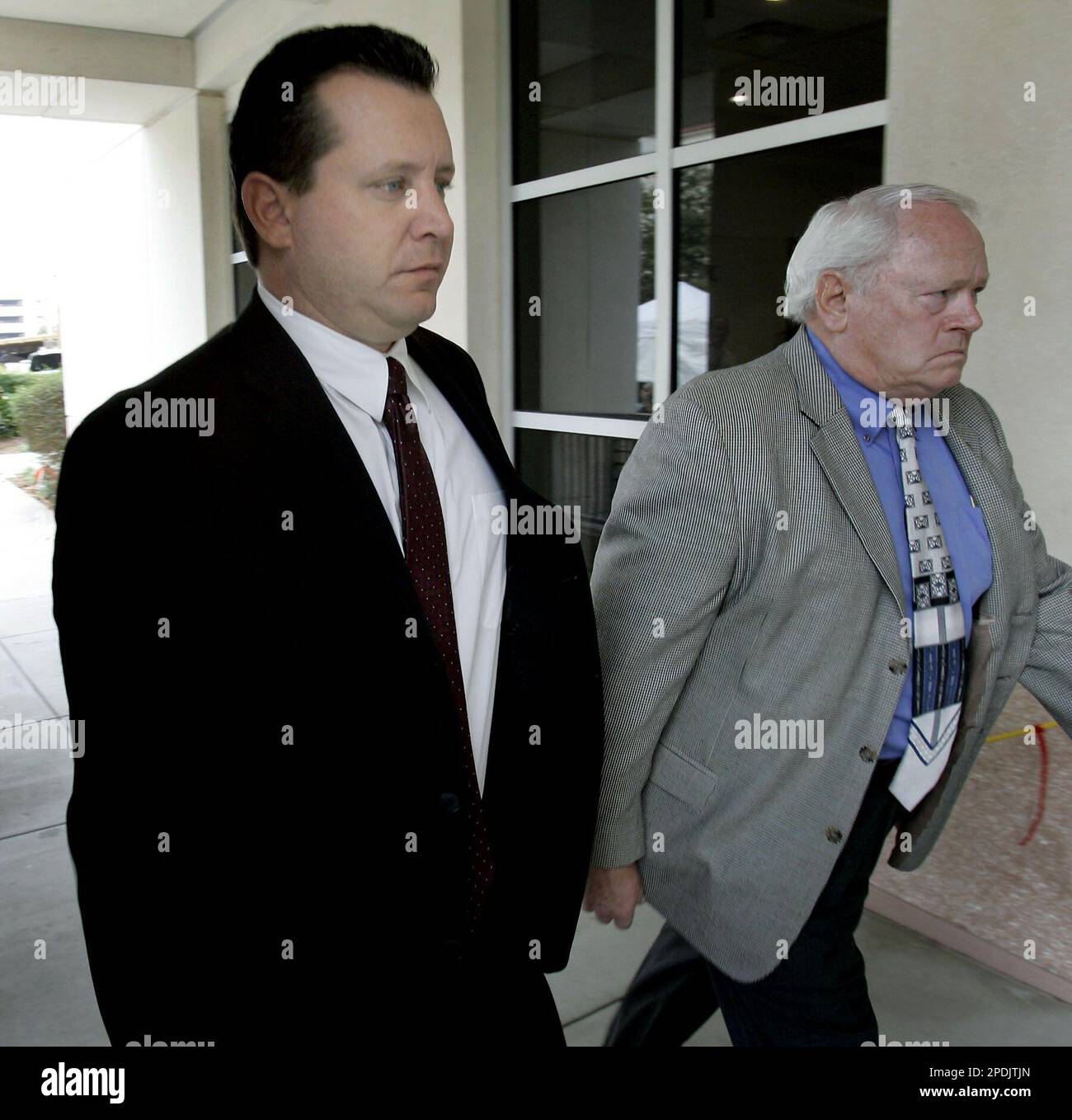 Joe Brucia, Carlie Brucia's father, left, heads back into the Sarasota ...