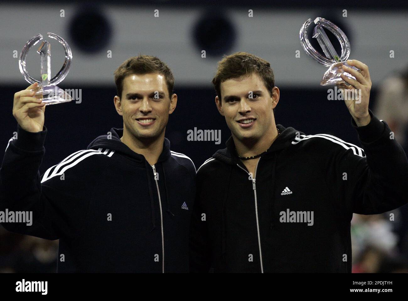 United State's Mike Bryan, left, and Bob Bryan, right, pose for photos ...