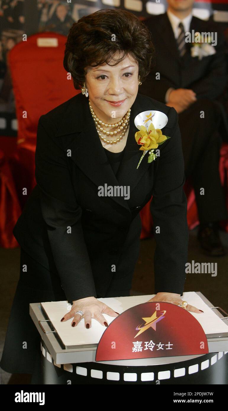 Hong Kong veteran actress Kar Ling poses during a hand imprint ceremony ...