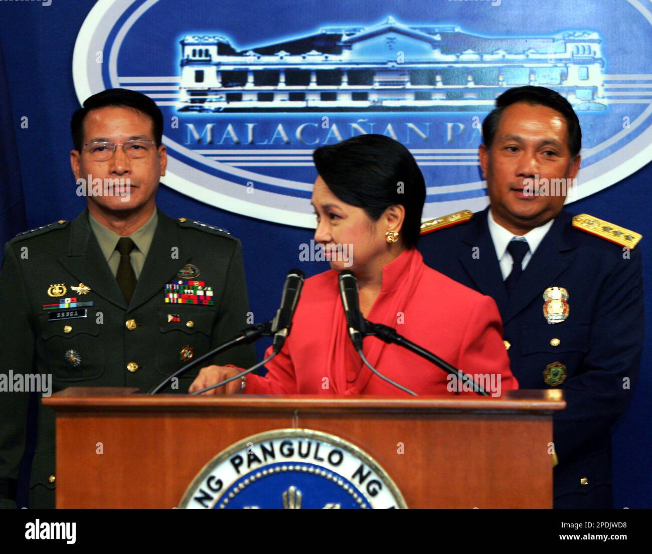 President Gloria Macapagal Arroyo, center, introduces Armed Forces of ...