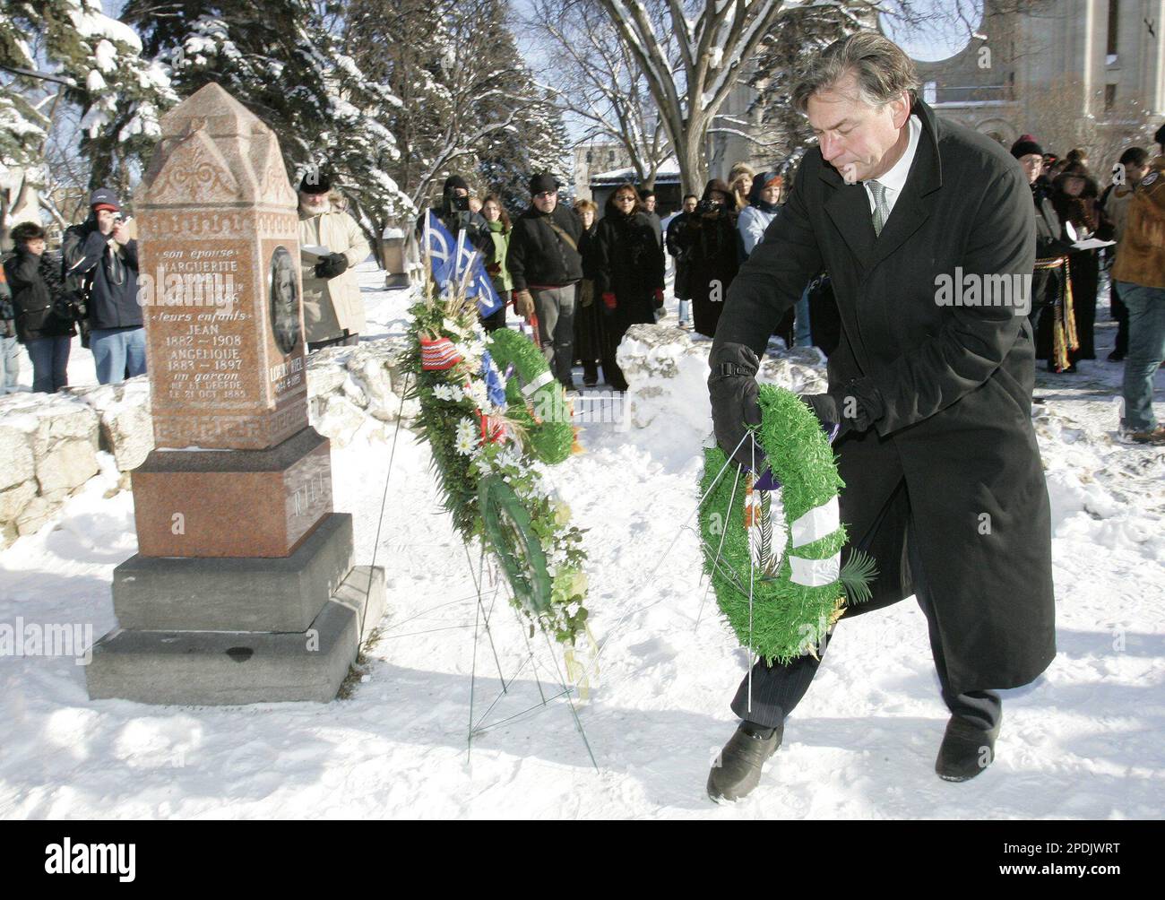 Manitoba Premier Gary Doer lays a wreath at the gravesite of Louis Riel ...