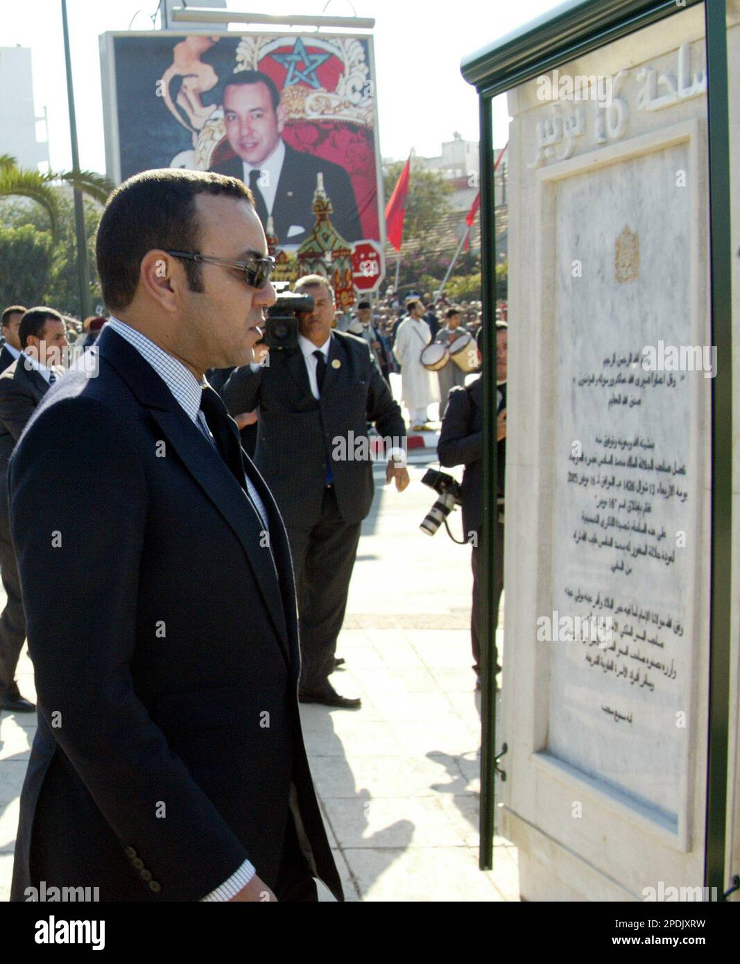 Moroccan King Mohammed VI reads a commemorative plaque during the ...