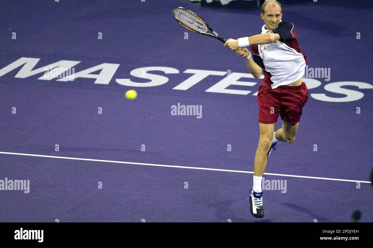 Russia's Nikolay Davydenko returns a ball from Argentina's Gaston ...