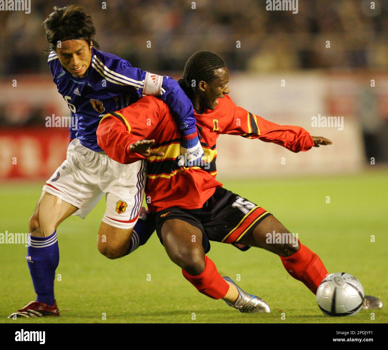 Maurito of Angola national team, right, battles for the ball with Japan ...