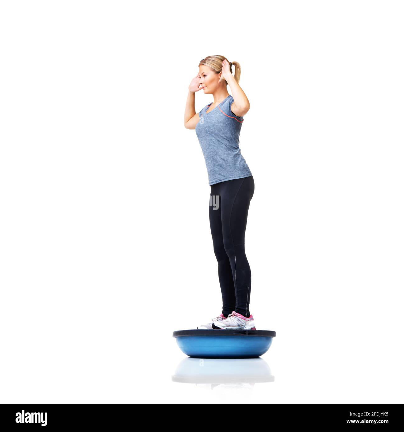 Shes focused on getting a full-body workout. An attractive young woman ...