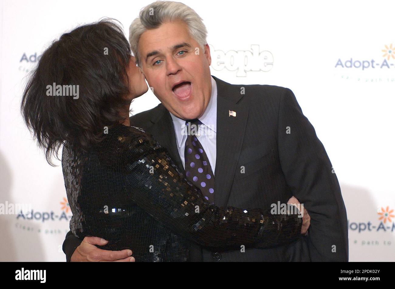Jay Leno reacts as his wife Mavis gives him a kiss before the Adopt-A ...
