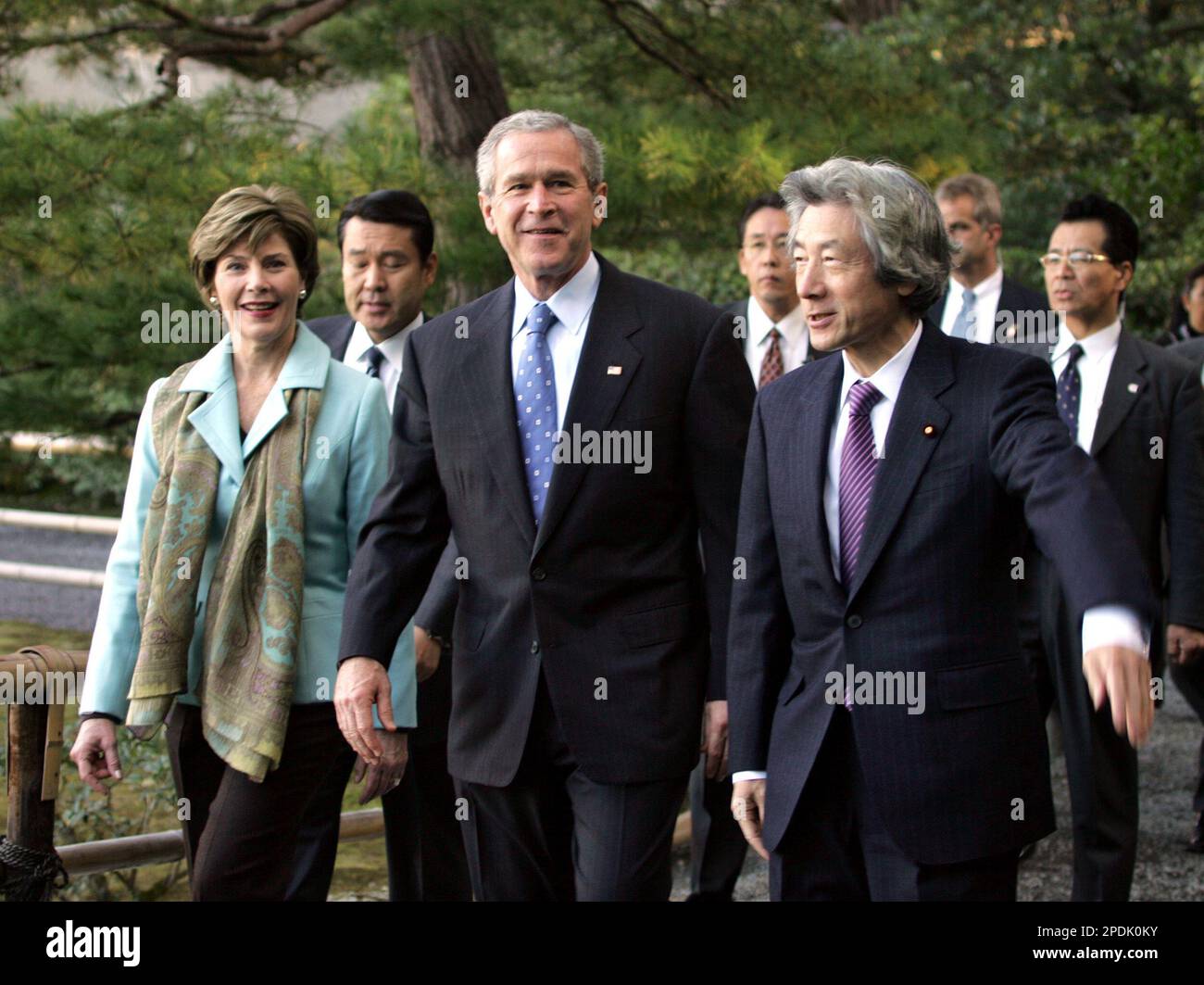 U.S. President George W. Bush, center, and First Lady Laura Bush are ...