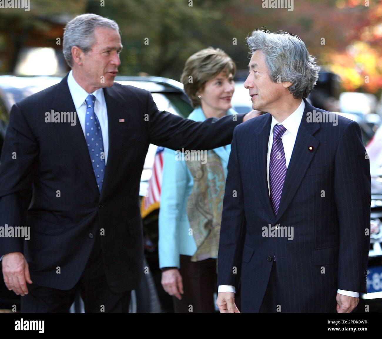 U.S. President George W. Bush and First Lady Laura Bush are welcomed by ...