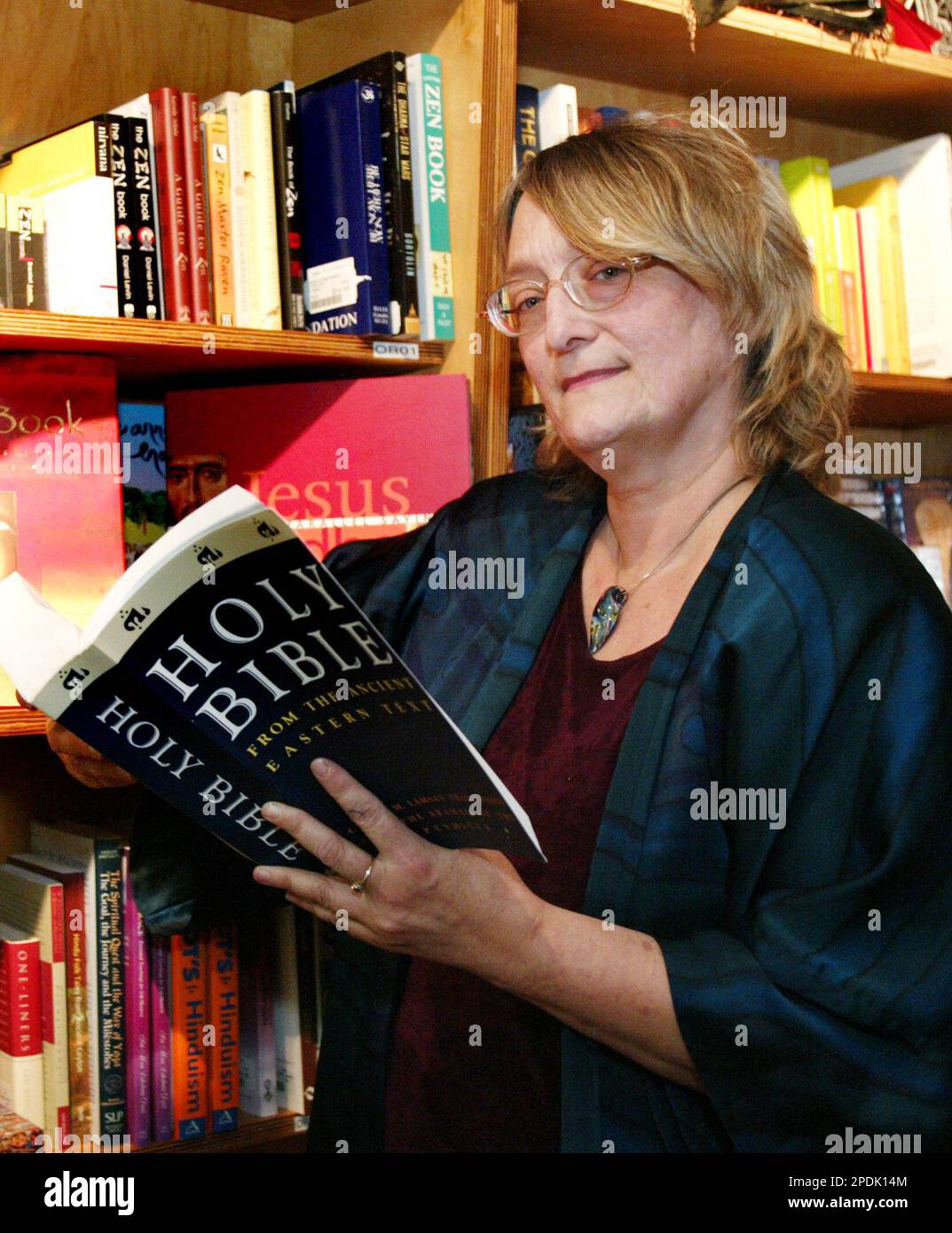 Candace Apple, who owns the Phoenix and Dragon Bookstore, holds the ...