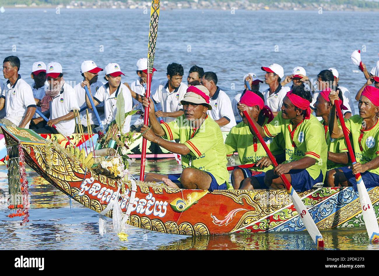 Cambodian boat crew paddle upstream after competing in the annual Water ...