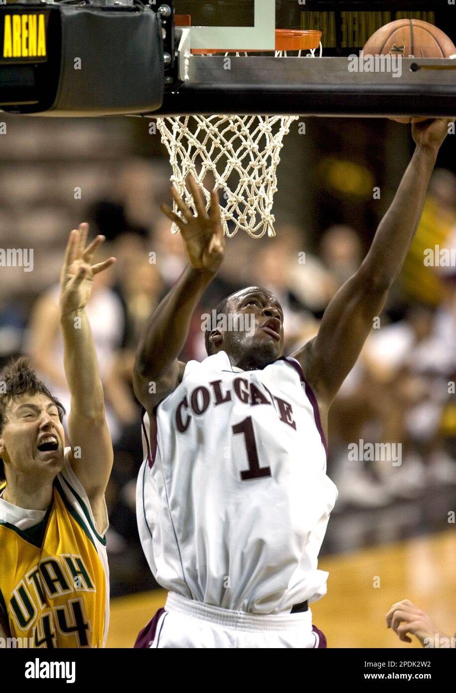 Colgate's Kyle Chones (1) drives to the basket in front of Utah Valley ...