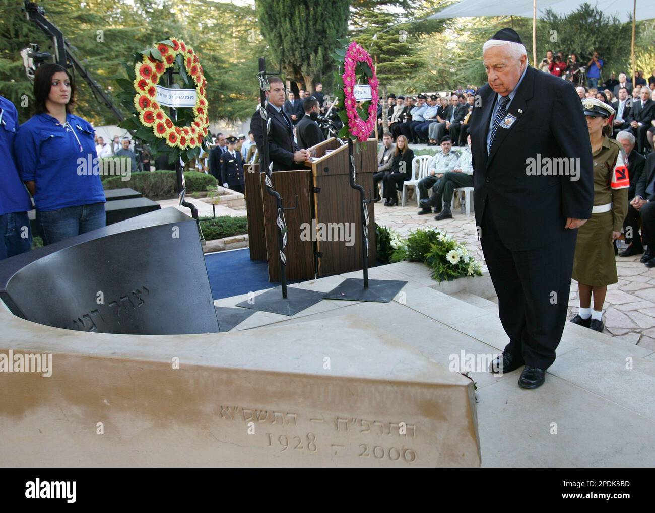 Israeli Prime Minister Ariel Sharon pauses for a moment after laying a ...