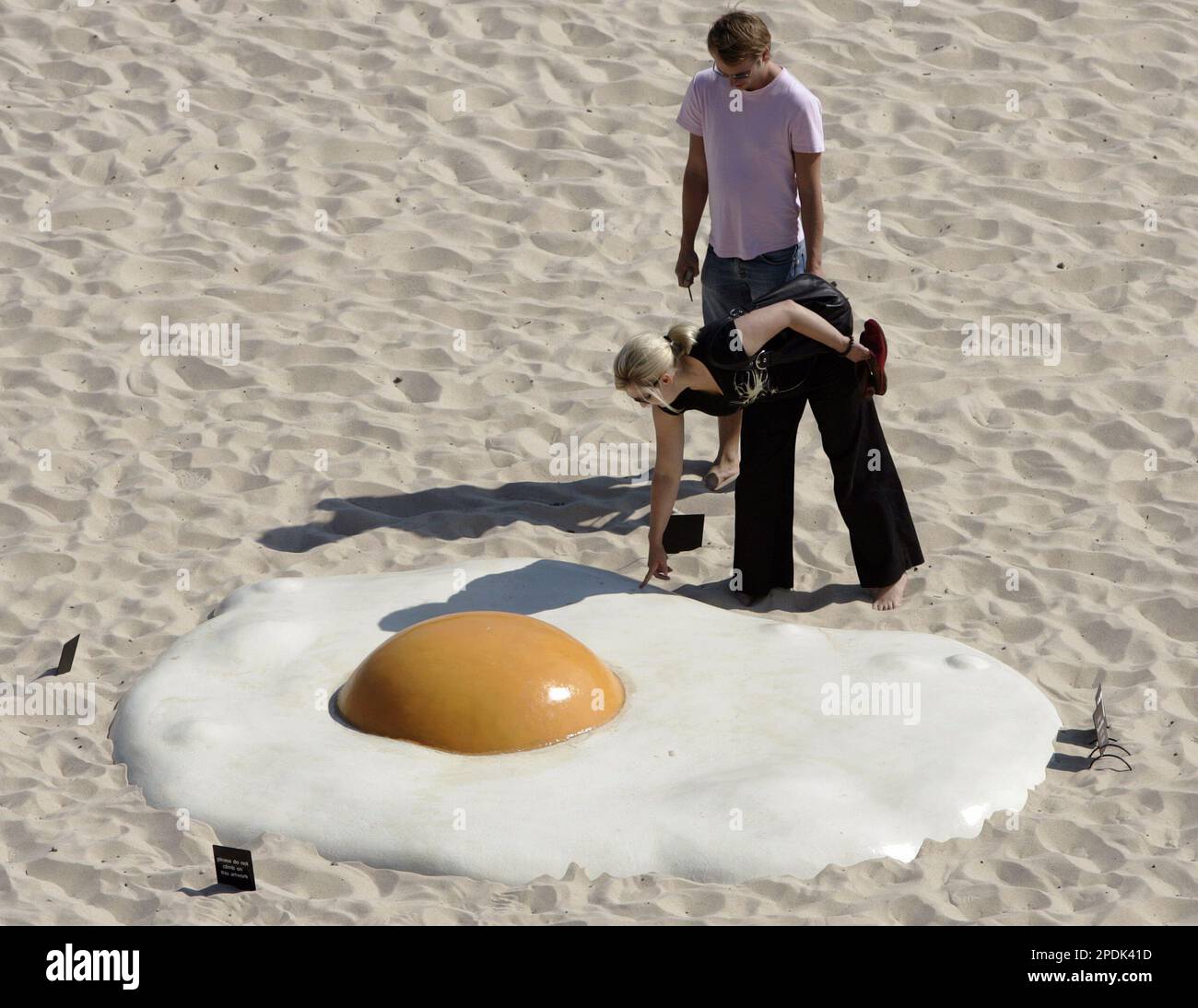 A couple look at an artwork called 'Big Chook', made of fibreglass and ...