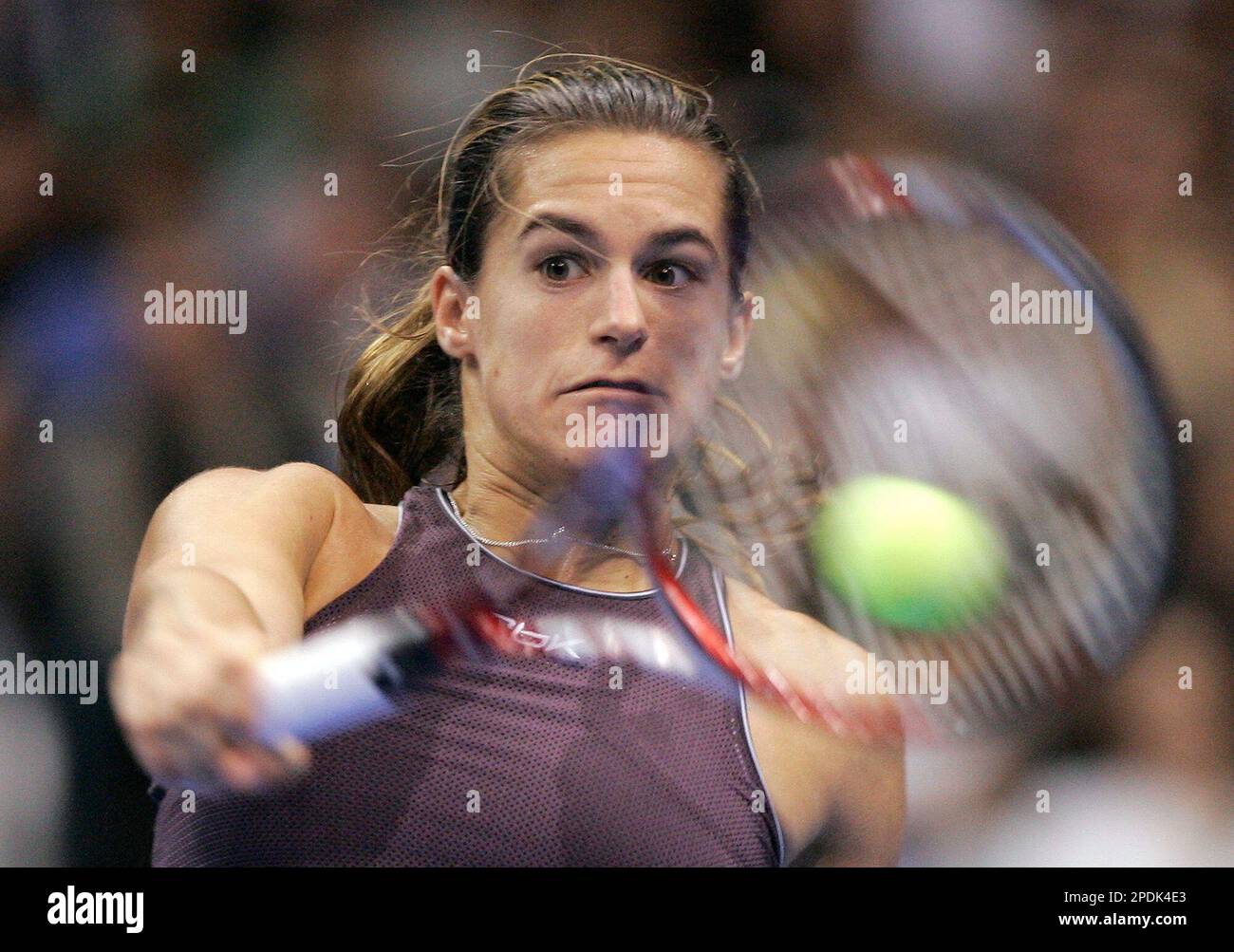 Amelie Mauresmo of France returns a shot to Mary Pierce of France at ...