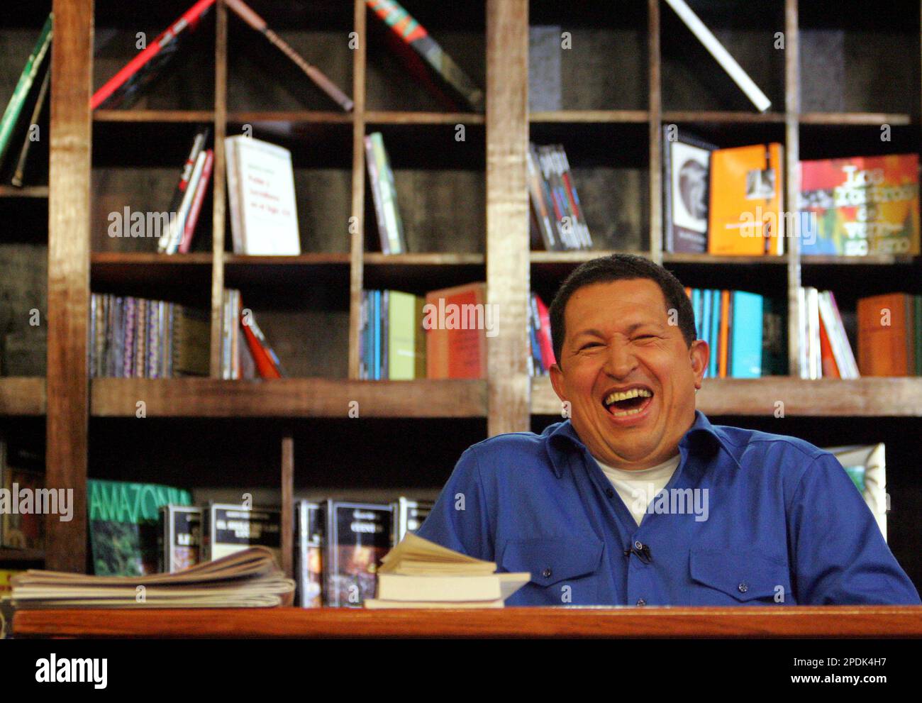 Venezuela's President Hugo Chavez laughs as he hosts his weekly live ...