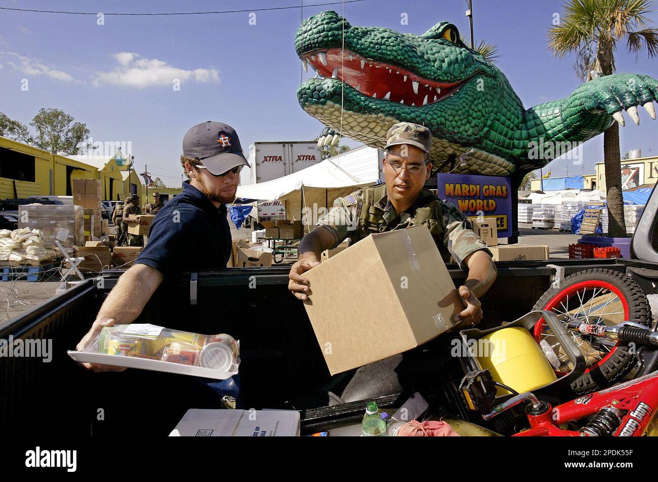 John Rhem, a firefighter from Southside Place, Texas, left, and Sgt ...