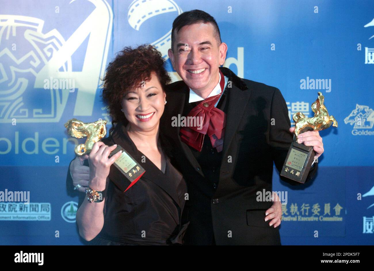 Hong Kong actors Yuen Qiu, right, and Anthony Wong, smile after ...