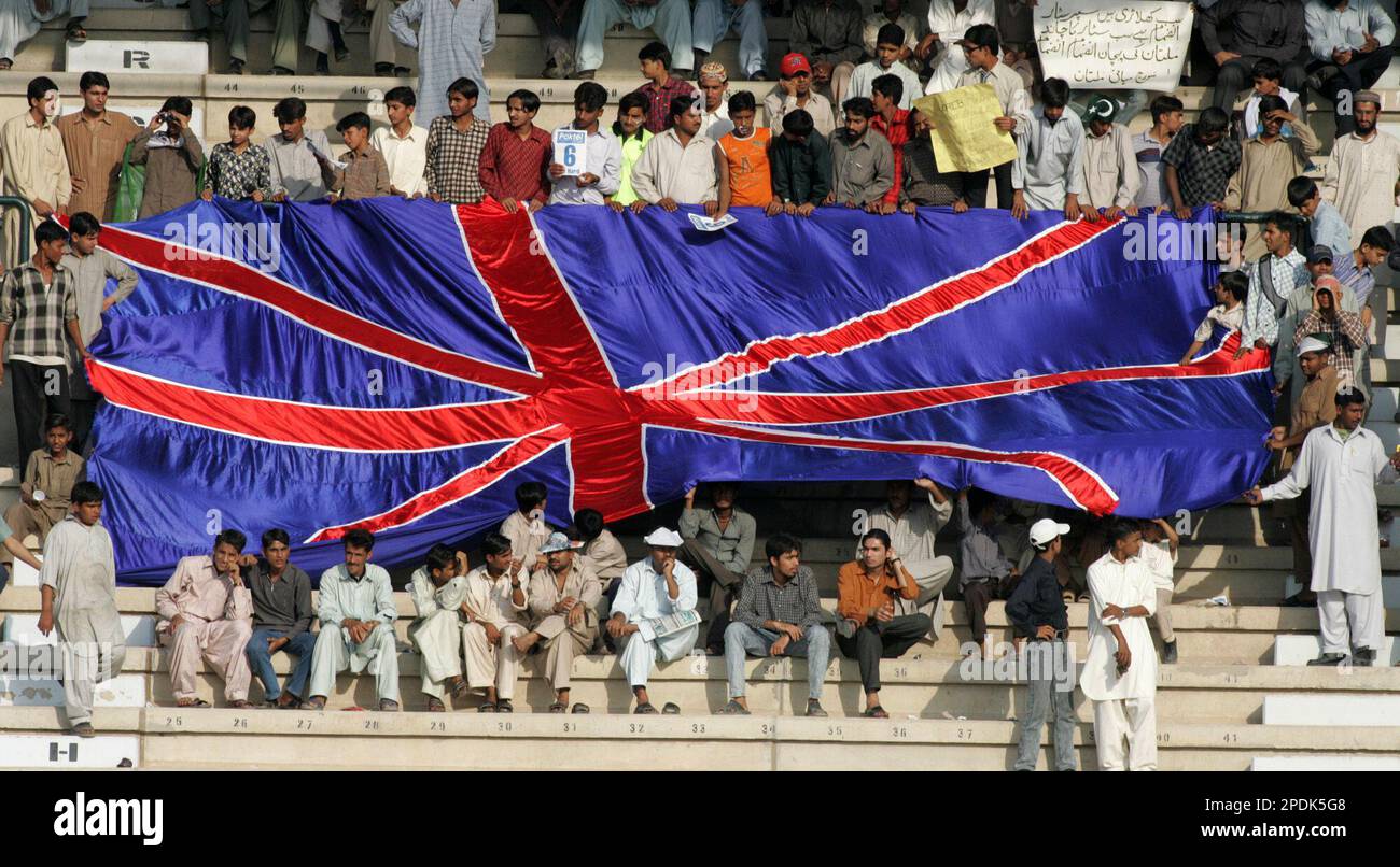 Pakistani cricket fans hold huge Britain flag, Sunday, Nov, 13, 2005 ...