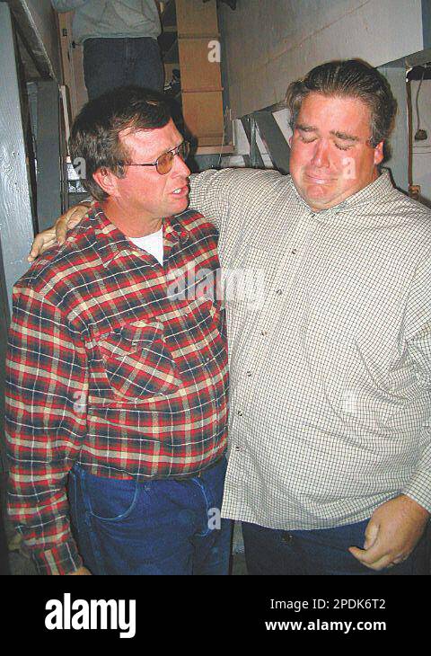 Brain Meunier, right, embraces co-worker Tom Willwerth after Meunier ...