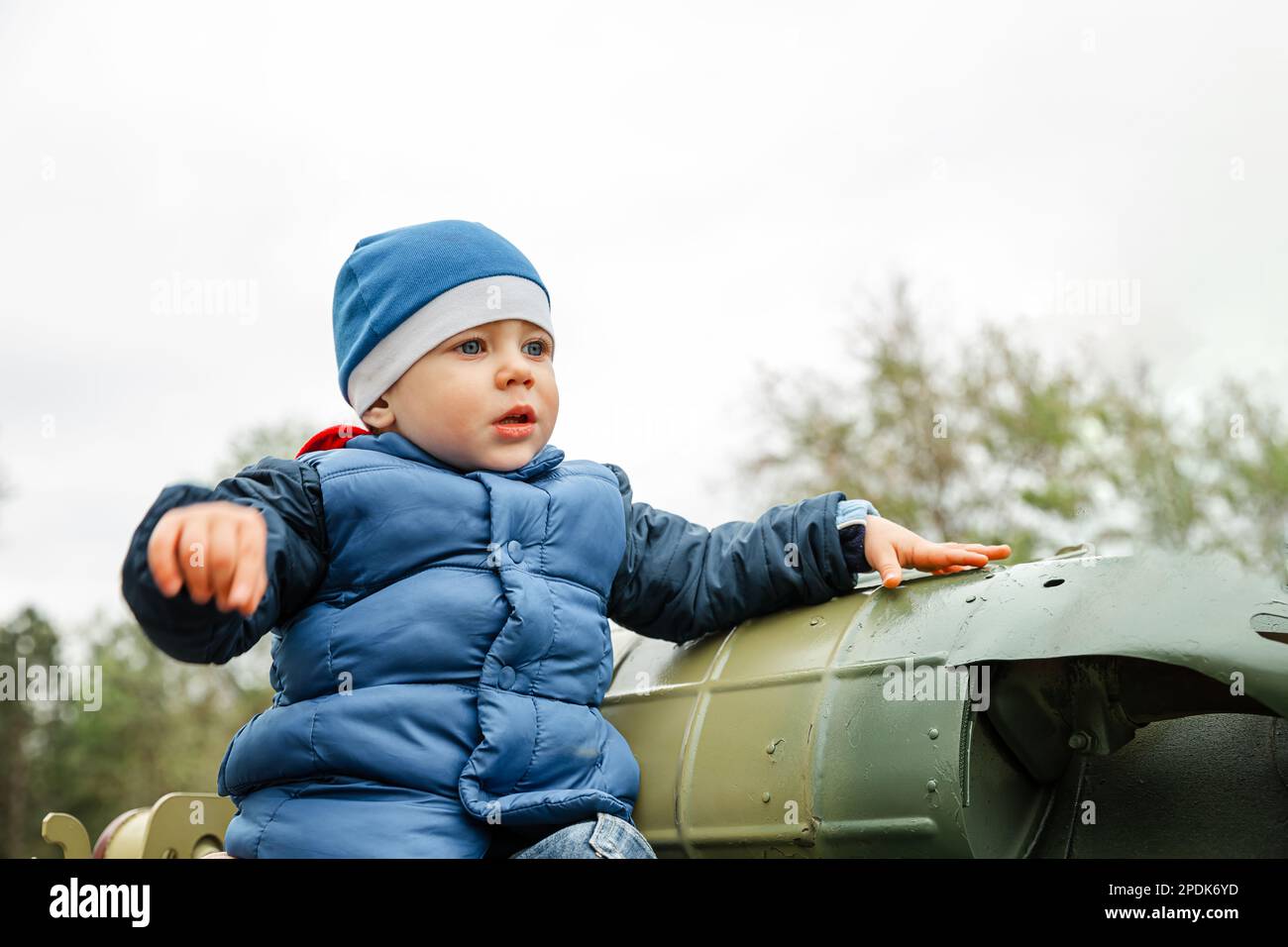 Portrait of young boy. Boy playing military tank Stock Photo - Alamy