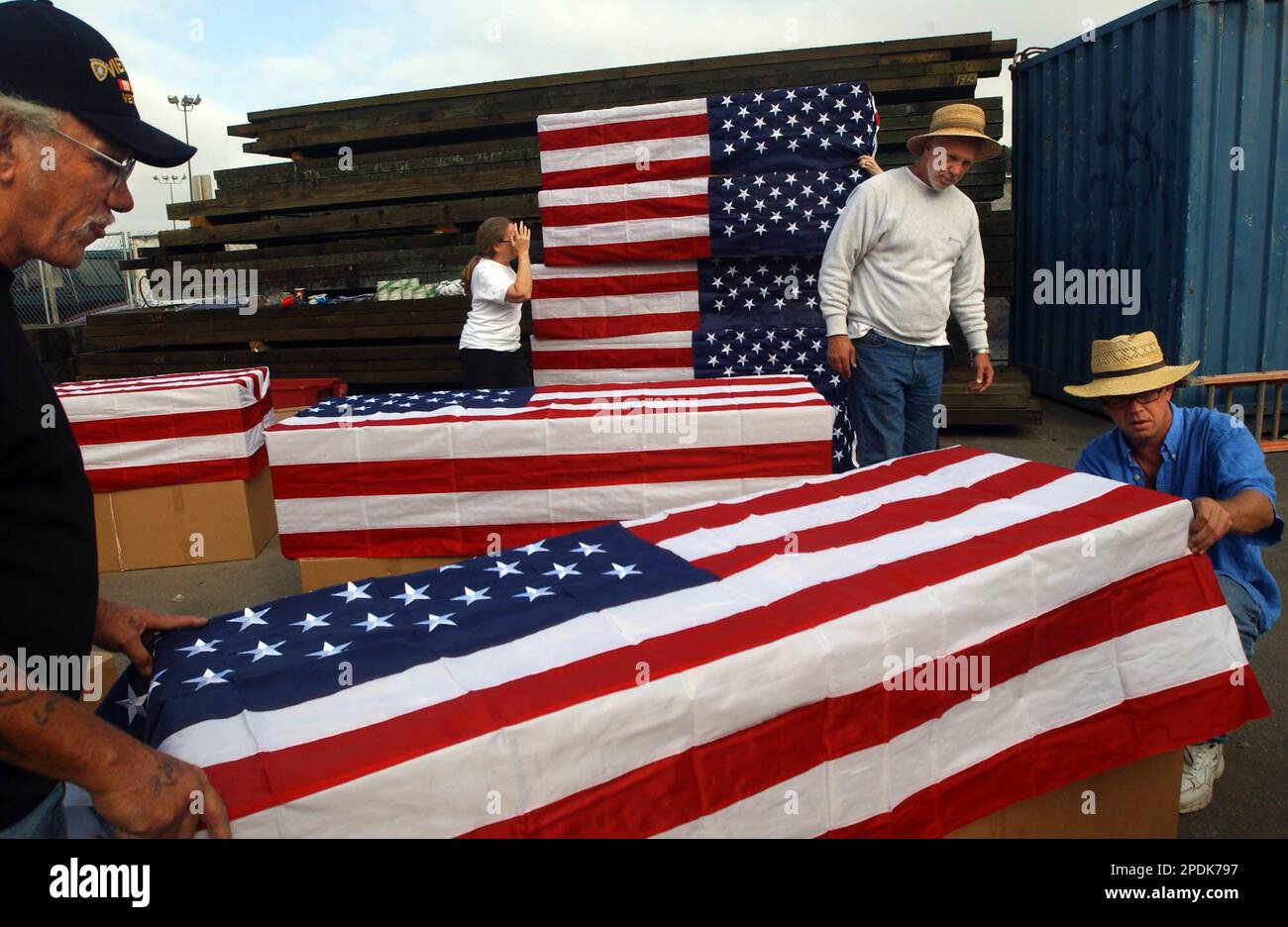 Volunteers with Veterans for Peace, David Redfeather, from left, Kitty ...