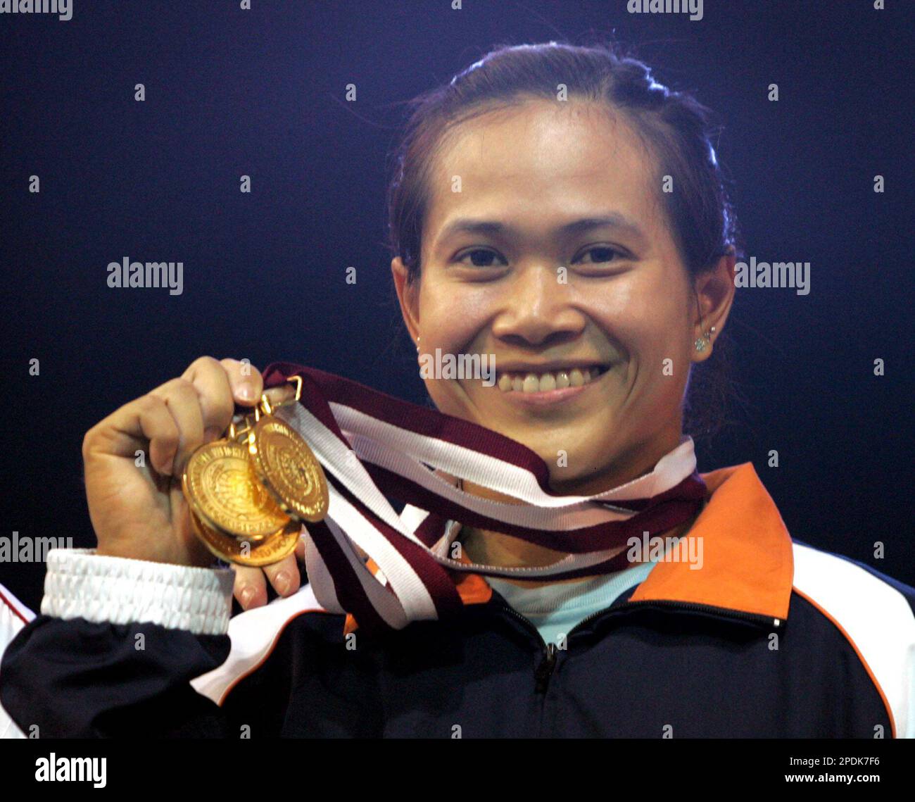 Pawina Thongsuk from Thailand holds her three gold medals from the ...