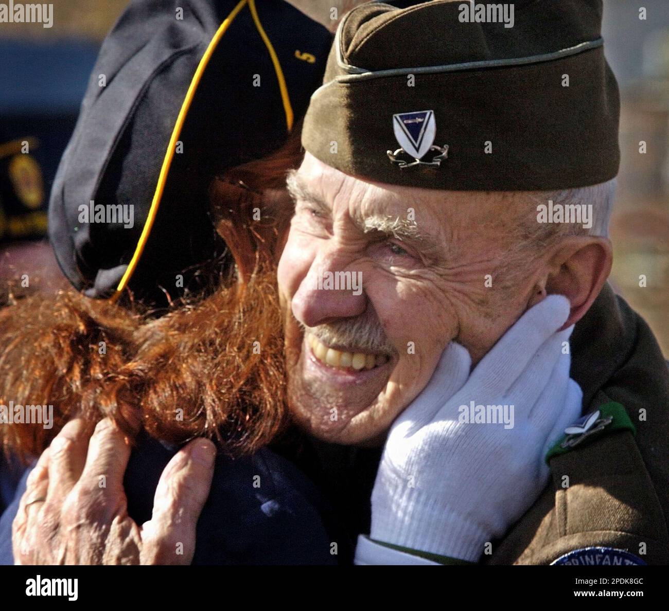 Veteran Bob Castonguay, of Winslow, Maine, gets a hug from Stephanie ...