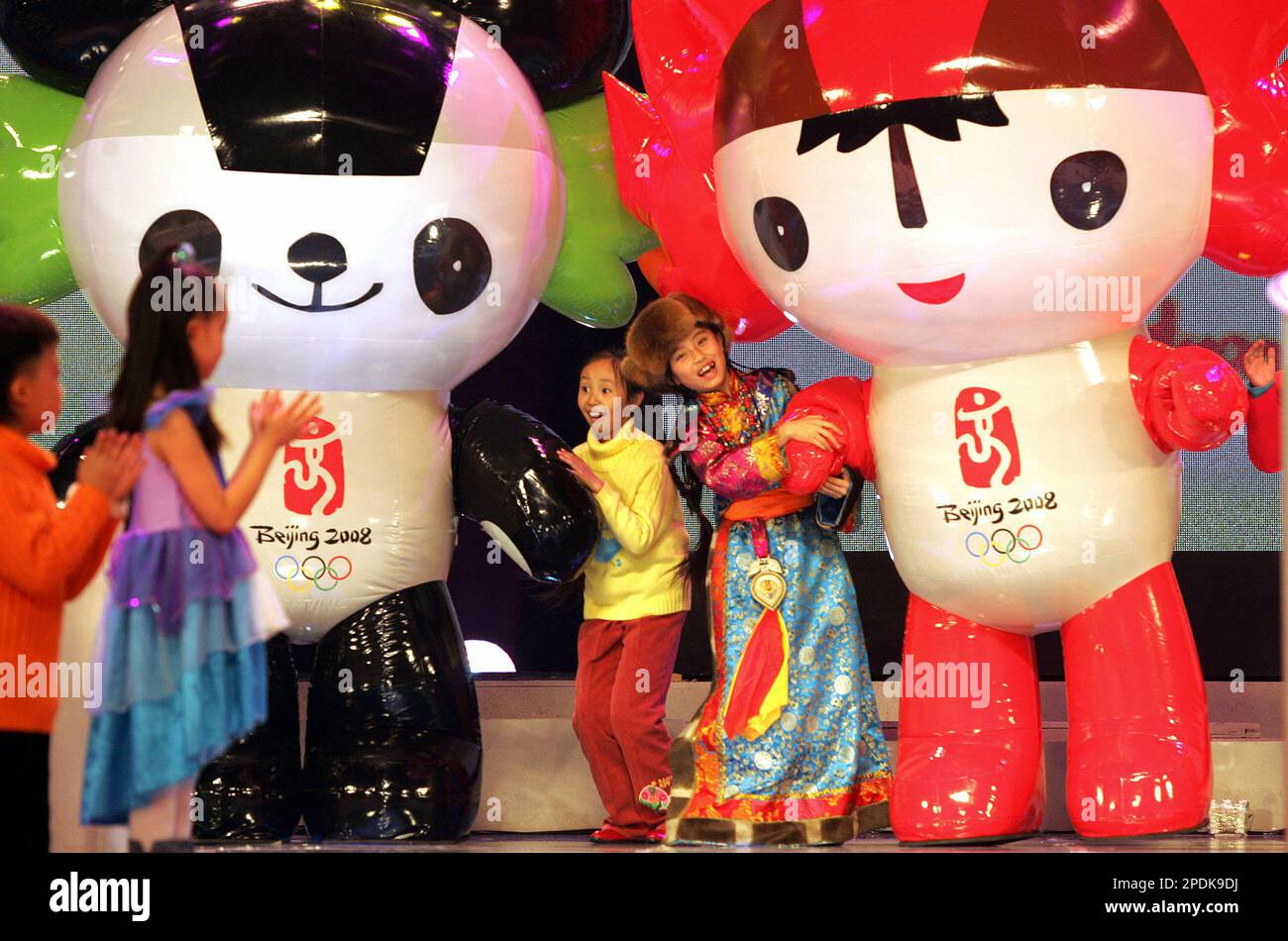 Girls dance with the mascots for the 2008 Olympic Games at an unveiling ...
