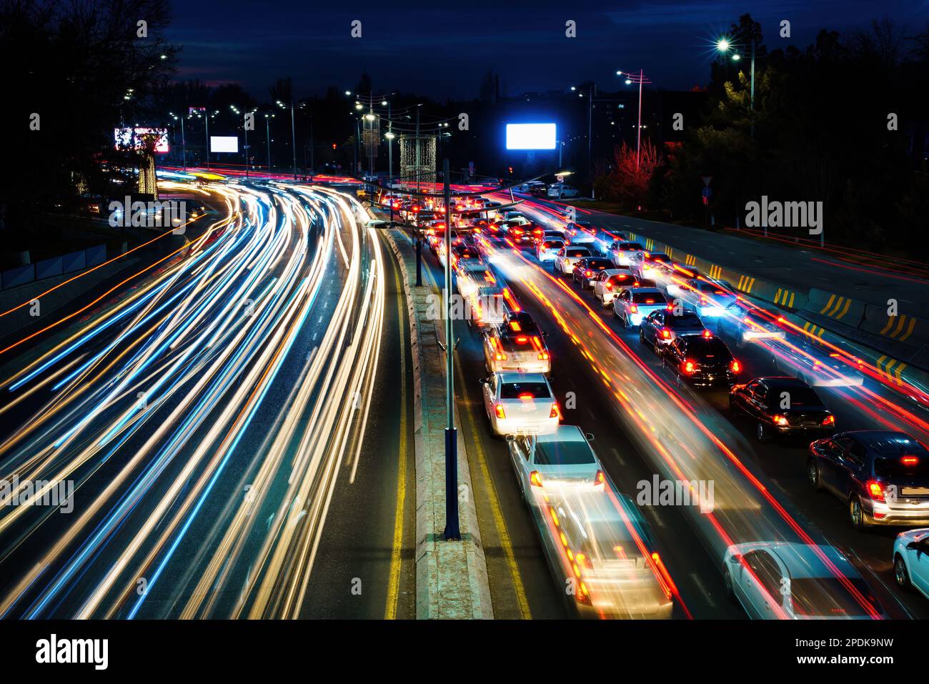 Car traffic light at night city highway Stock Photo - Alamy