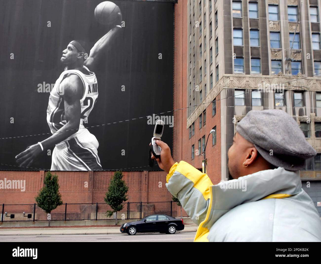 Tyler Newell of Washington, D.C., uses his cell phone camera to take a ...