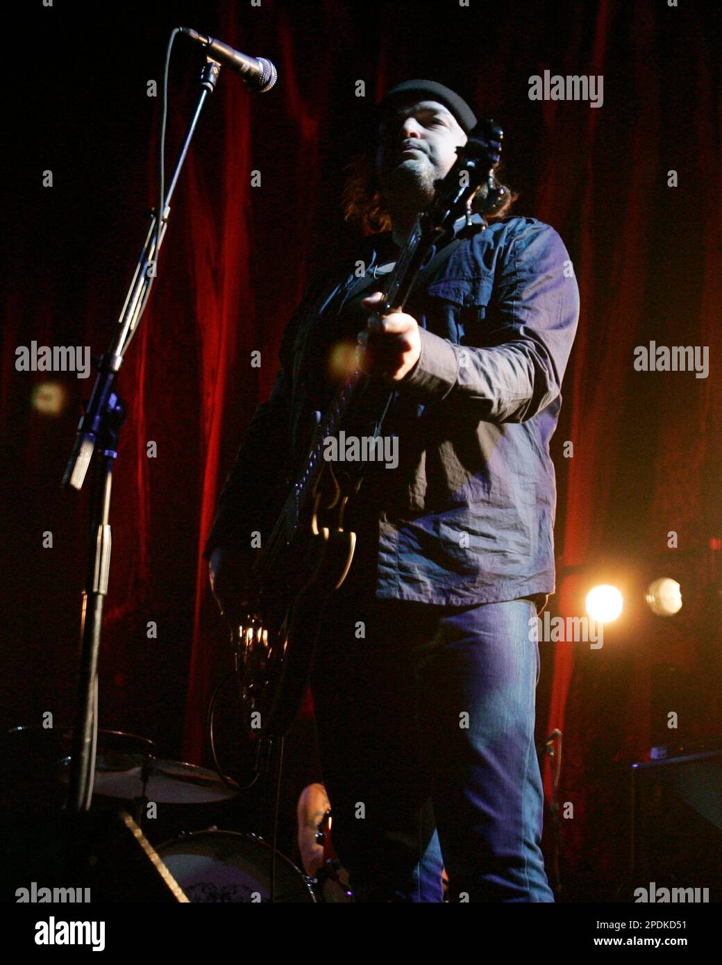 Bass player Alain Johannes of the rock band Queens of the Stone Age ...