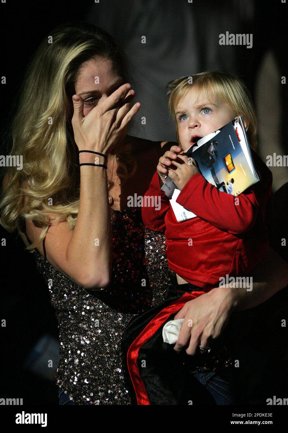 Katie Collier holds her daughter Elezan during a ceremony for her late ...
