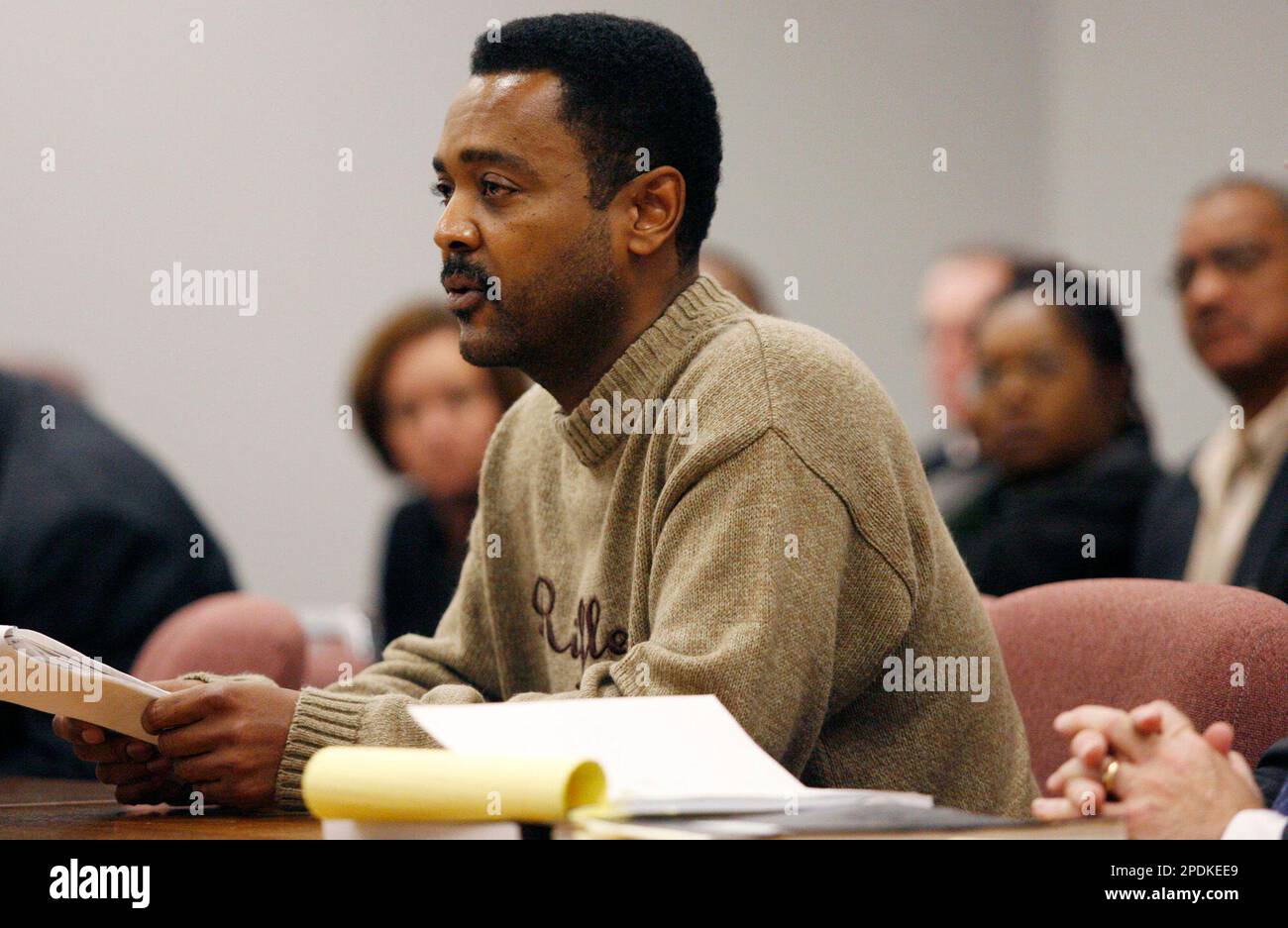 Ricardo Hicks speaks on behalf of his brother John R. Hicks during a ...