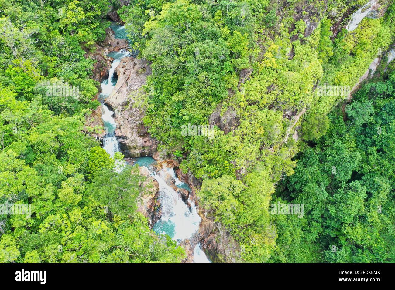 Bird's eye drone shot of the spectacular Cunca Rami waterfall on Flores ...