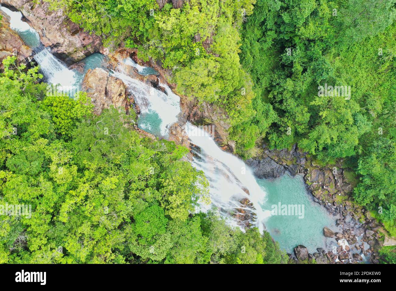 Bird's eye drone shot of the spectacular Cunca Rami waterfall on Flores ...