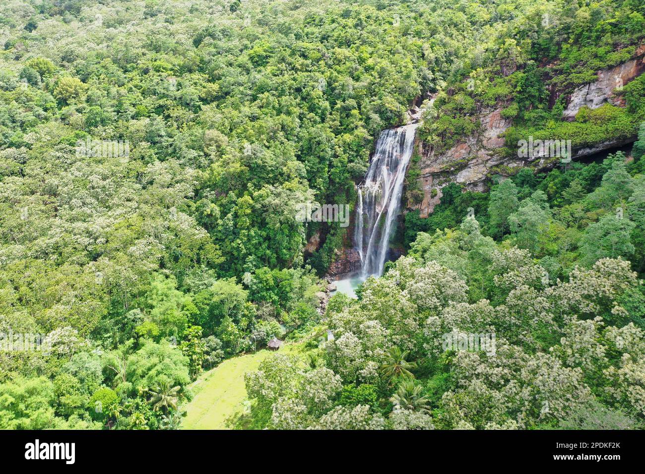 Bird's eye drone shot of the spectacular Cunca Rami waterfall on Flores ...