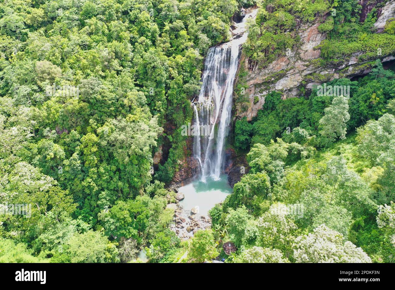 Bird's eye drone shot of the spectacular Cunca Rami waterfall on Flores ...