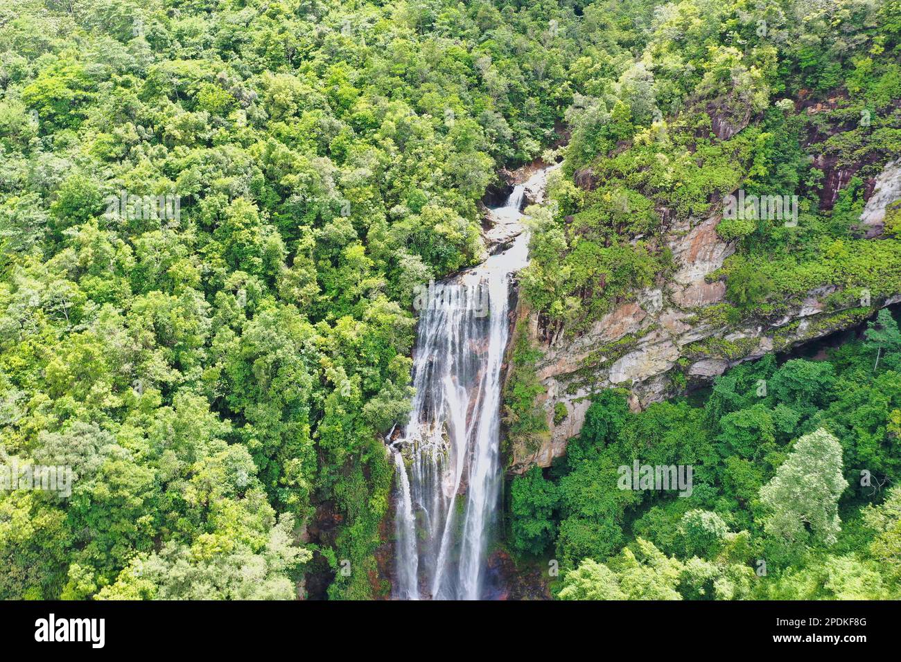 Bird's eye drone shot of the spectacular Cunca Rami waterfall on Flores ...