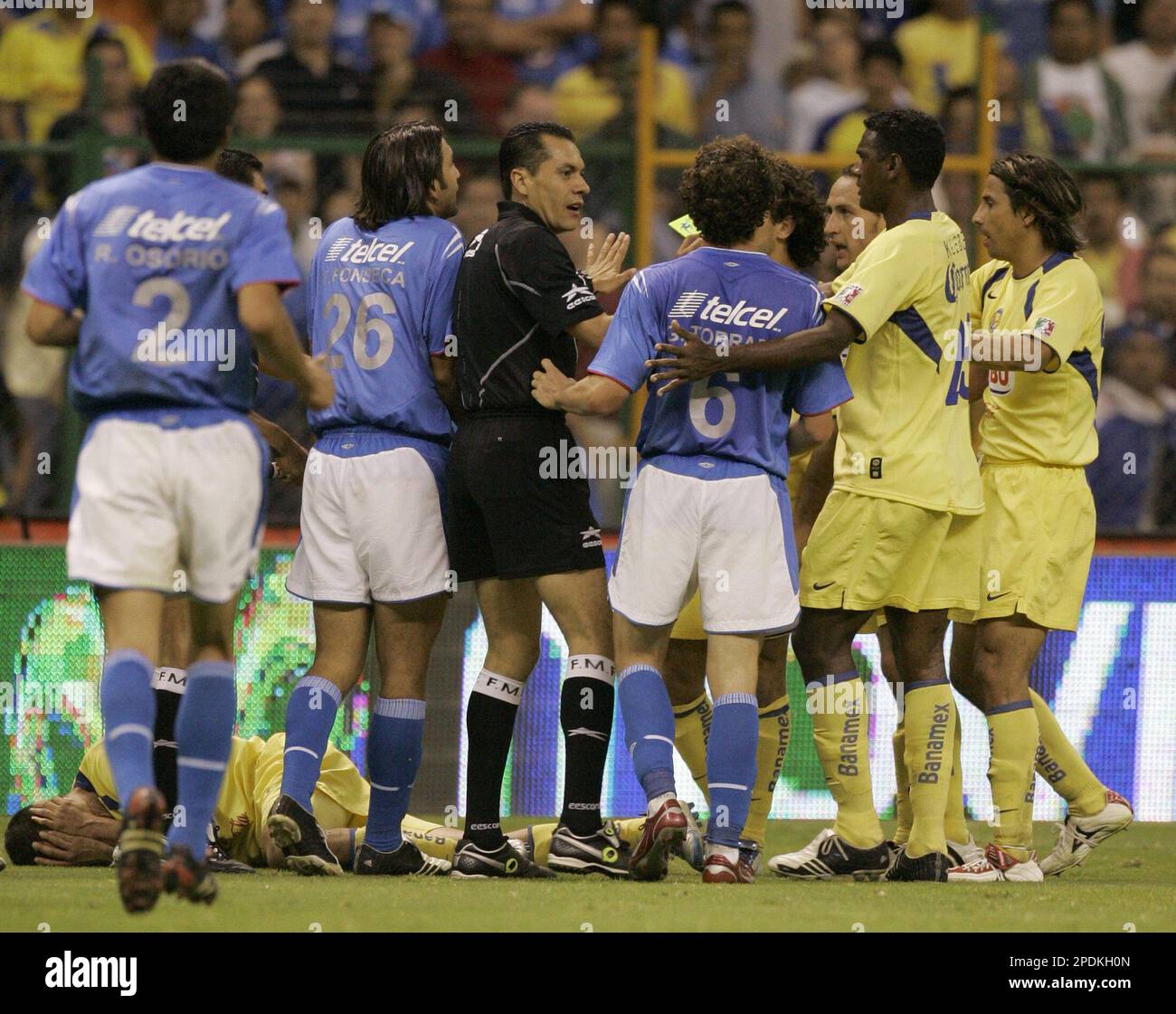 America's soccer players, right, fight with Cruz Azul's players at the ...
