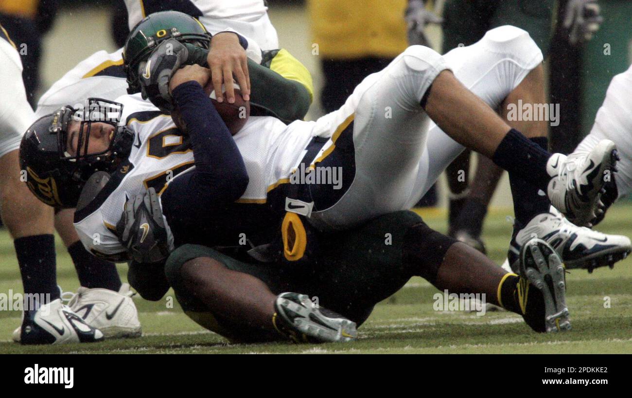 California's quarterback Joe Ayoob is sacked by Oregon's Blair Phillips ...