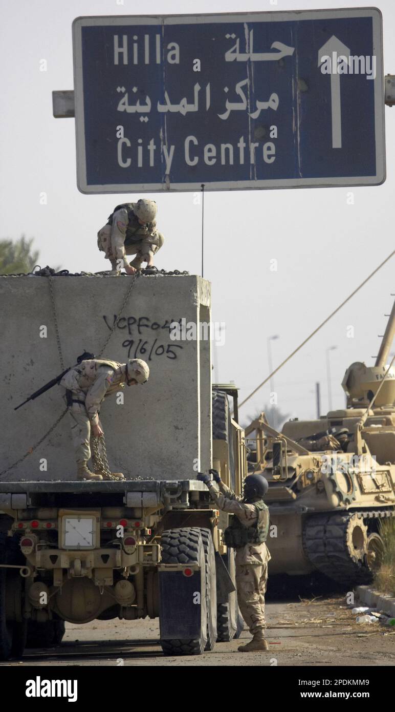 U.S. Army soldiers install a concrete bunker at an Iraqi Army ...