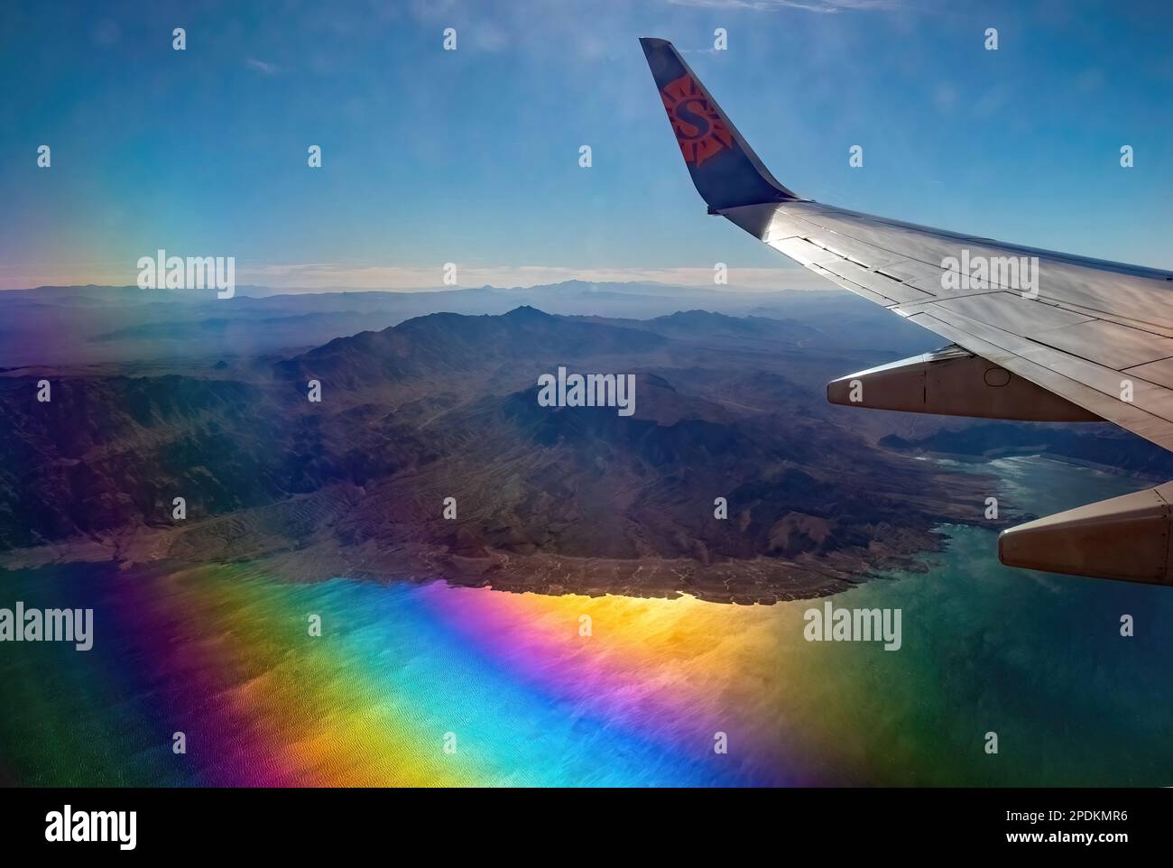 Flight with Sun Country Airlines flying over the landscape of hills ...