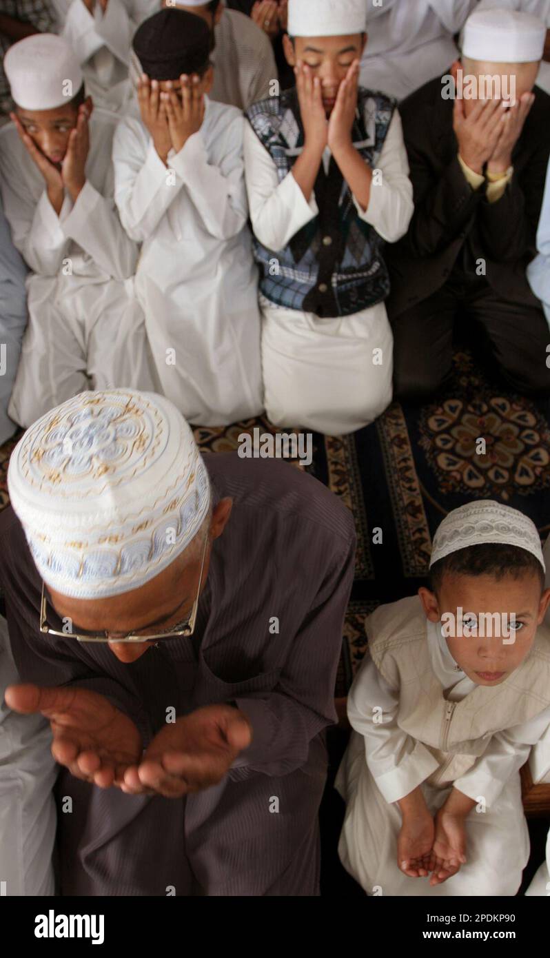 Muslims attend prayers, Friday, Nov. 4, 2005, as they celebrate Eid al ...