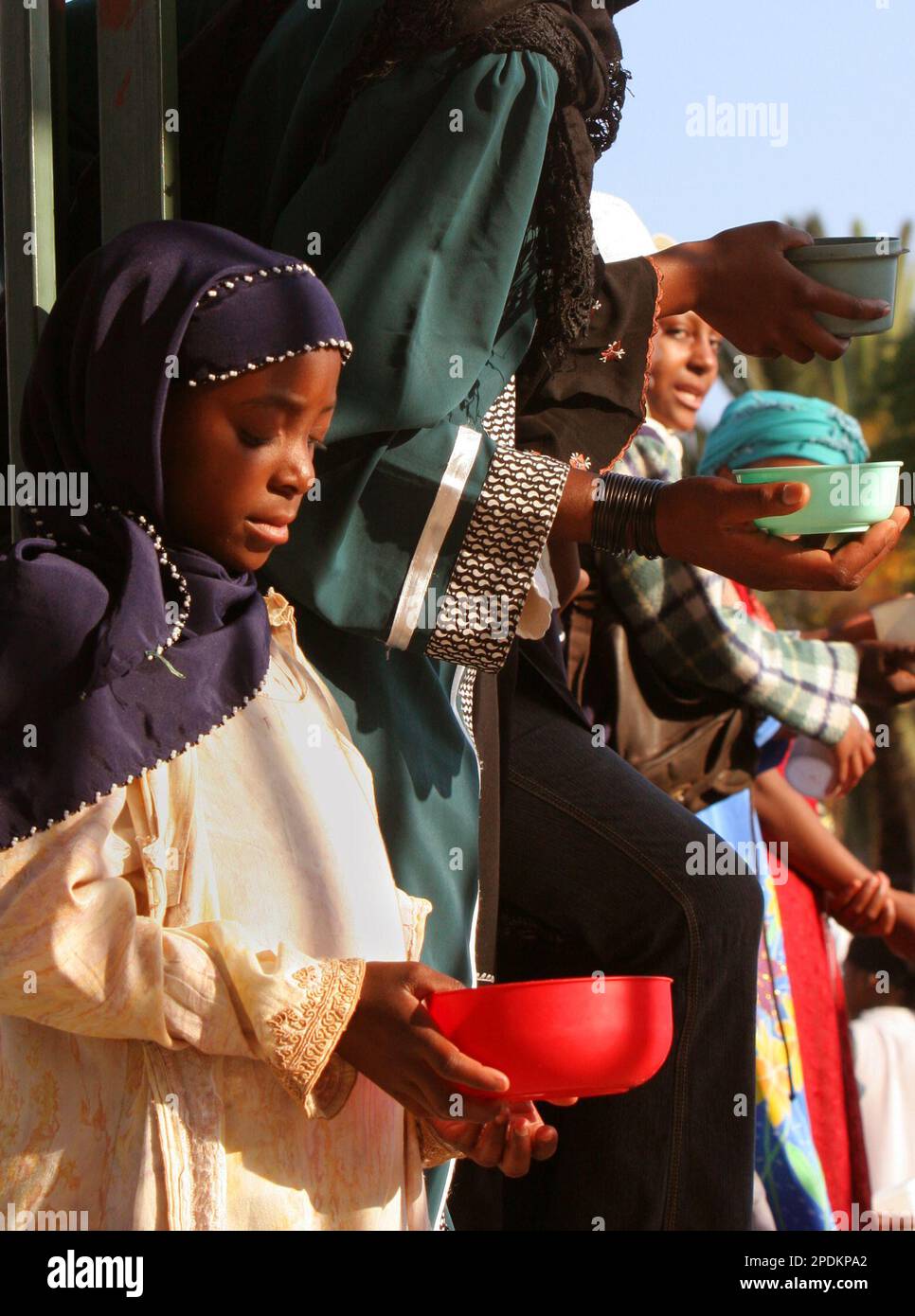 Beggars wait outside the Bosmont mosque in Johannesburg, Friday Nov. 4 ...
