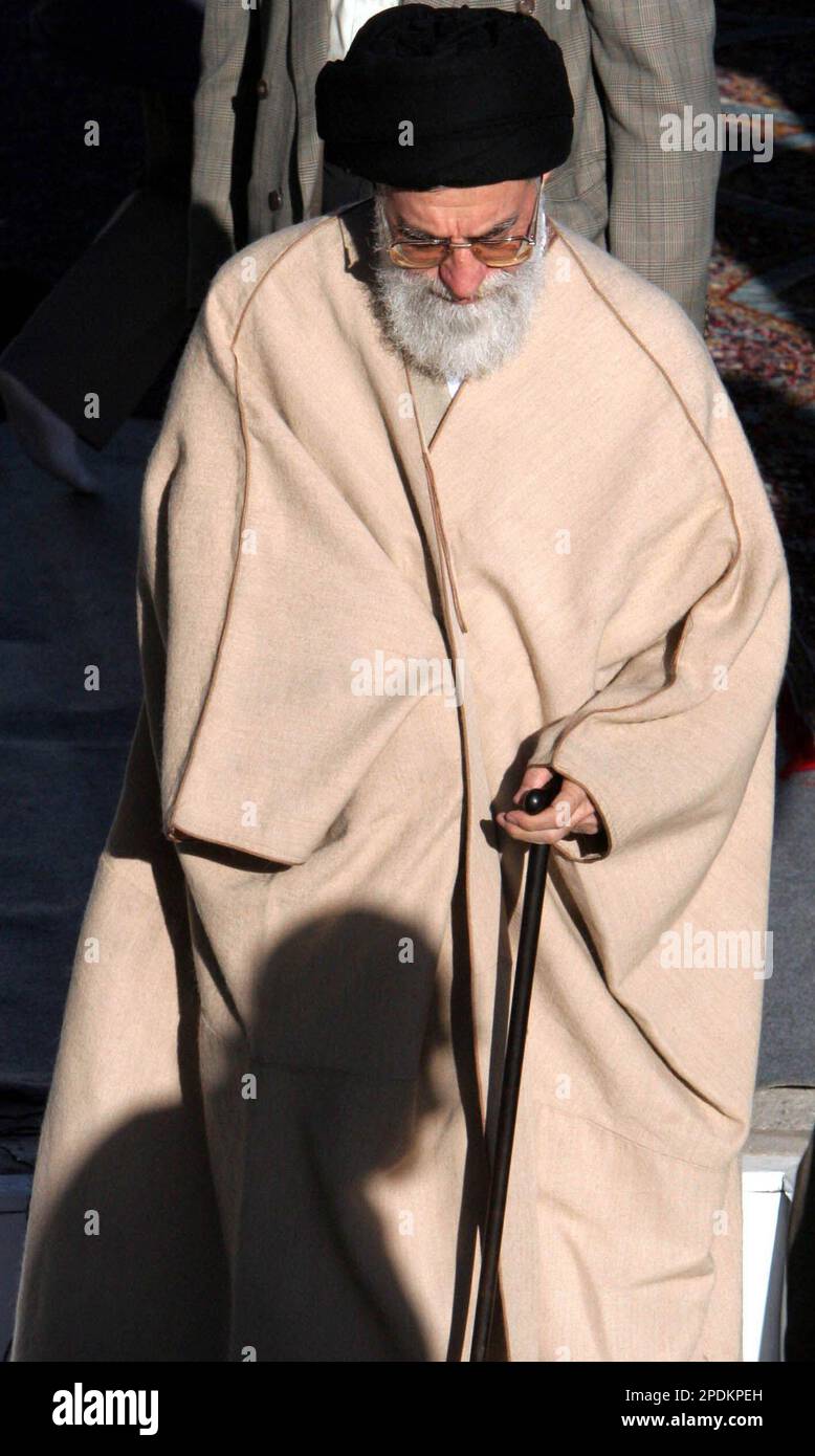 As the morning sun casts a shadow of his bodyguard, Iran's supreme ...