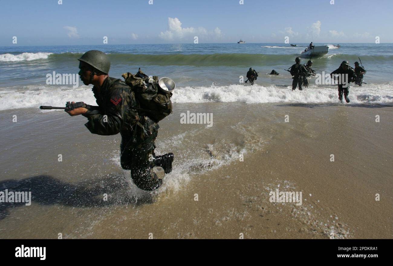 Venezuelan soldiers occupy a beach during a mock foreign invasion in ...