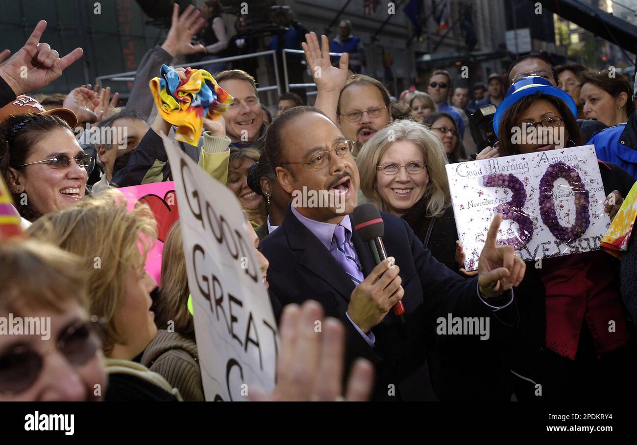 "Good Morning America" weatherman Tony Perkins, center, does a live ...